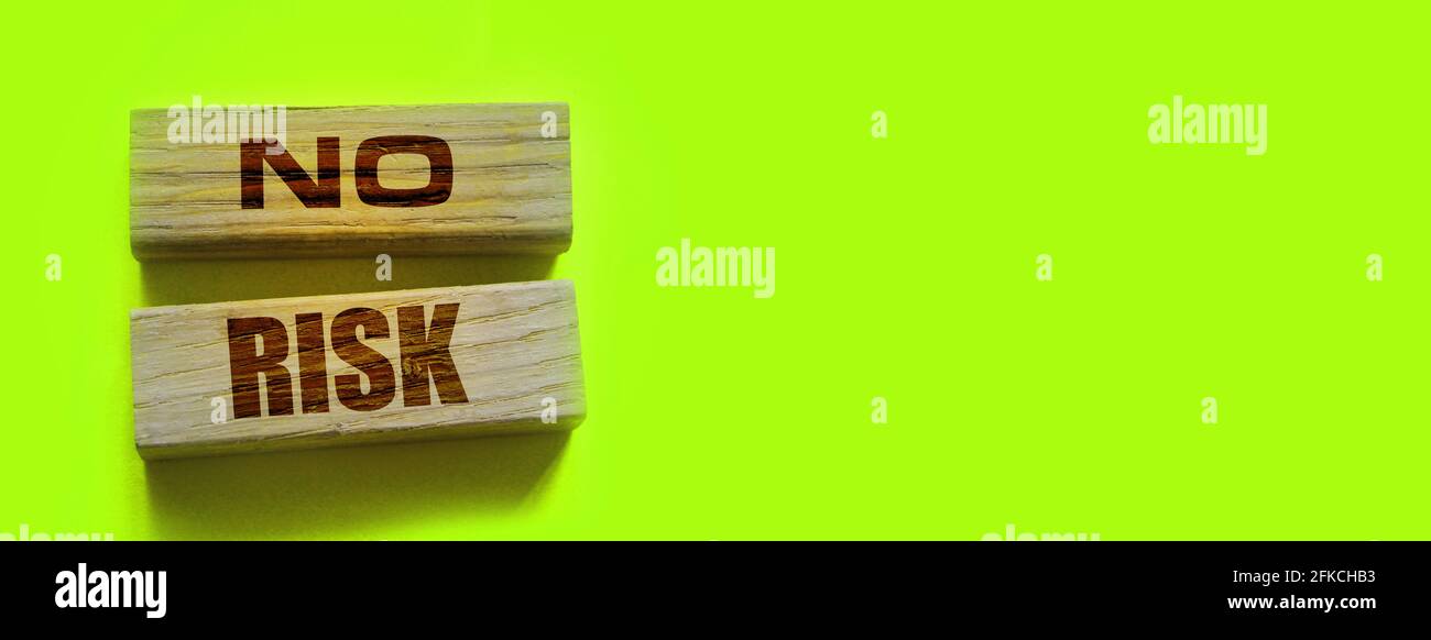 No Risk words on wooden blocks on yellow background. Risk management ...