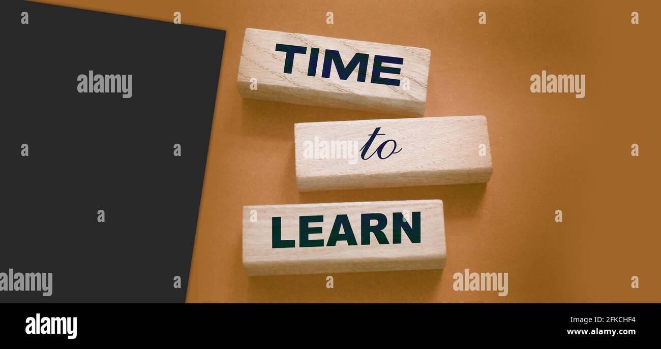 Time to Learn on wooden blocks put black. Education concept. Life-time ...