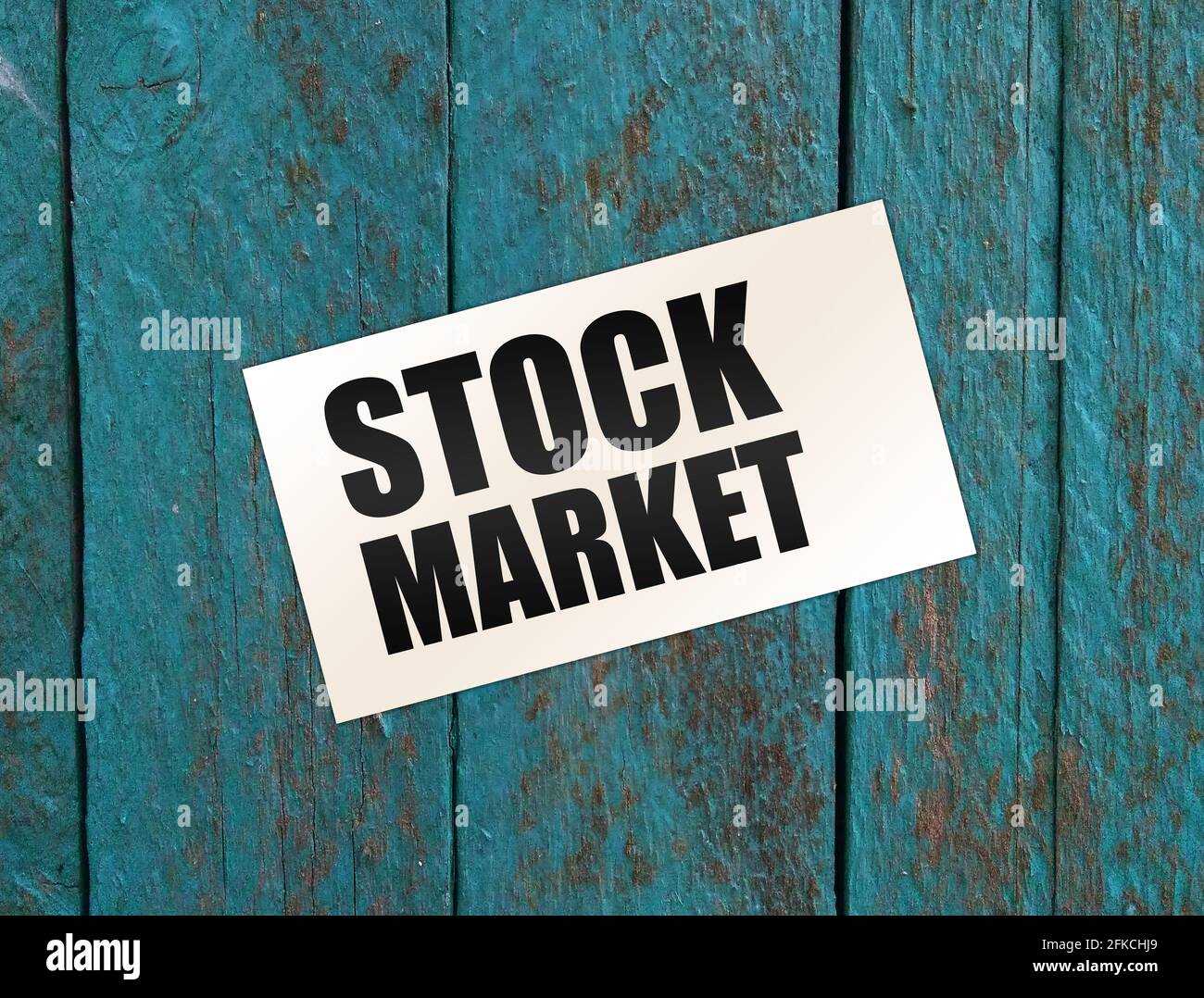 STOCK MARKET words on card on wooden table. Business concept Stock ...