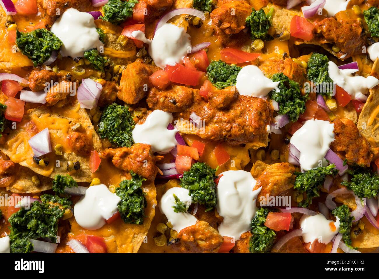 Homemade Indian Chicken Tikka Masala Nachos with Chutney and Corn Stock ...
