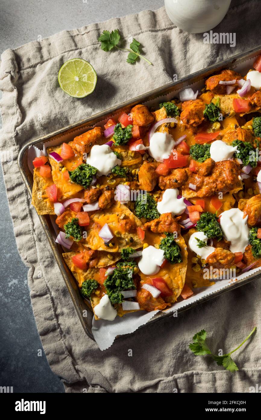 Homemade Indian Chicken Tikka Masala Nachos with Chutney and Corn Stock ...
