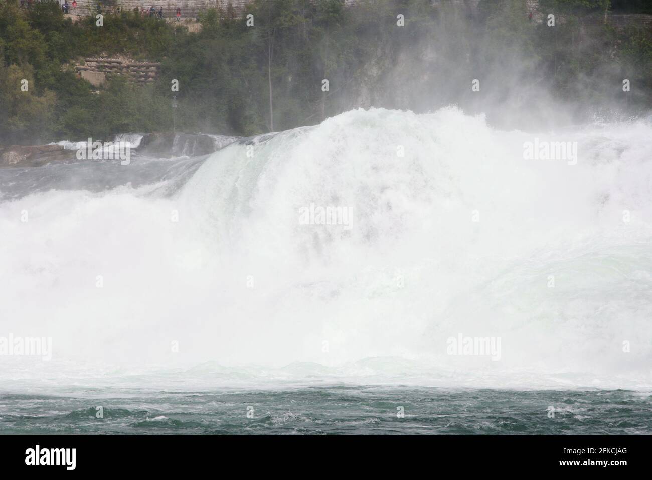 a waterfall with white, foaming in spray Stock Photo - Alamy