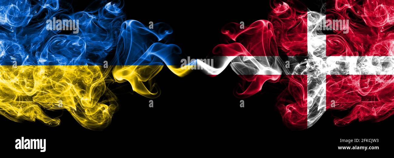 Ukraine, Ukrainian vs Denmark, Danish smoky mystic flags placed side by ...