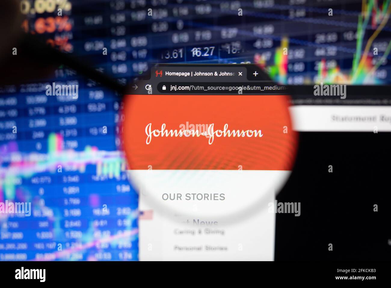 Johnson and Johnson company logo on a website with blurry stock market developments in the ...
