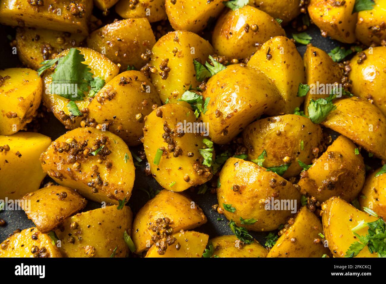Homemade Roasted Mustard Seed Potatoes with Cilantro Stock Photo - Alamy
