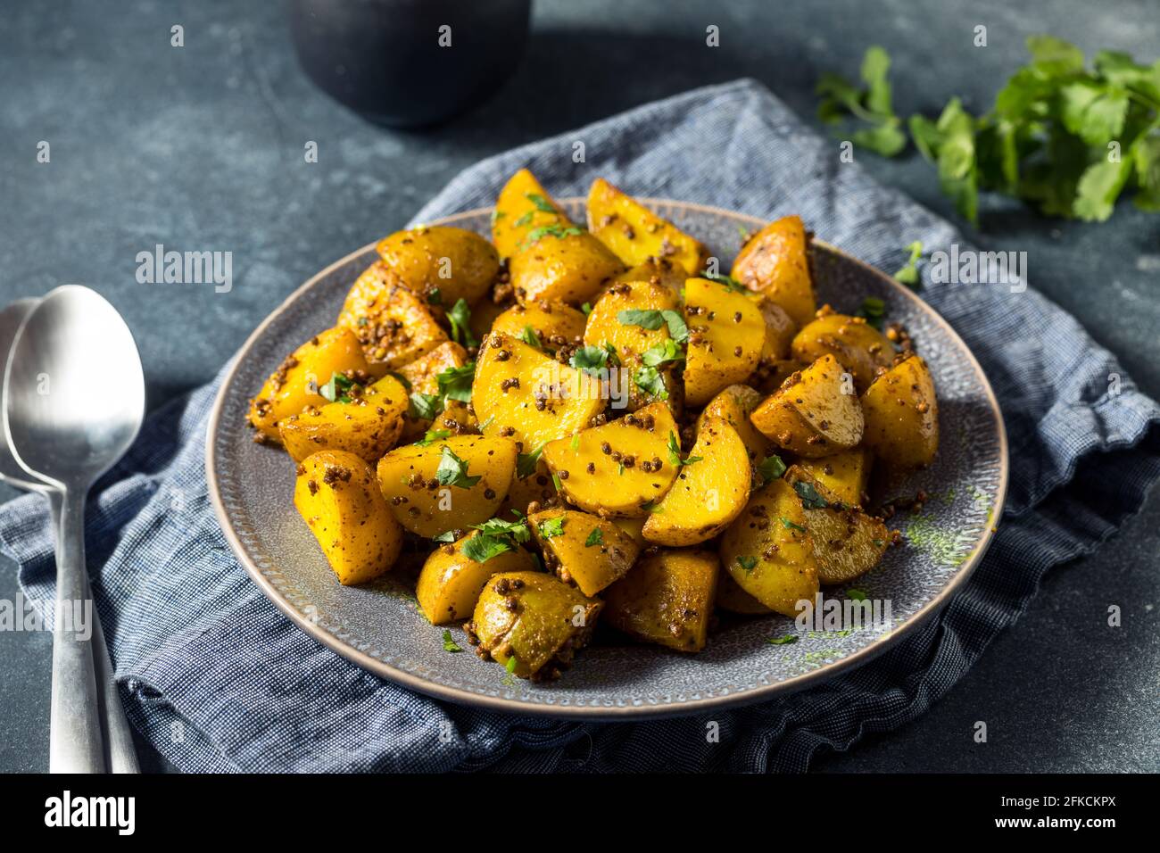 Homemade Roasted Mustard Seed Potatoes with Cilantro Stock Photo - Alamy