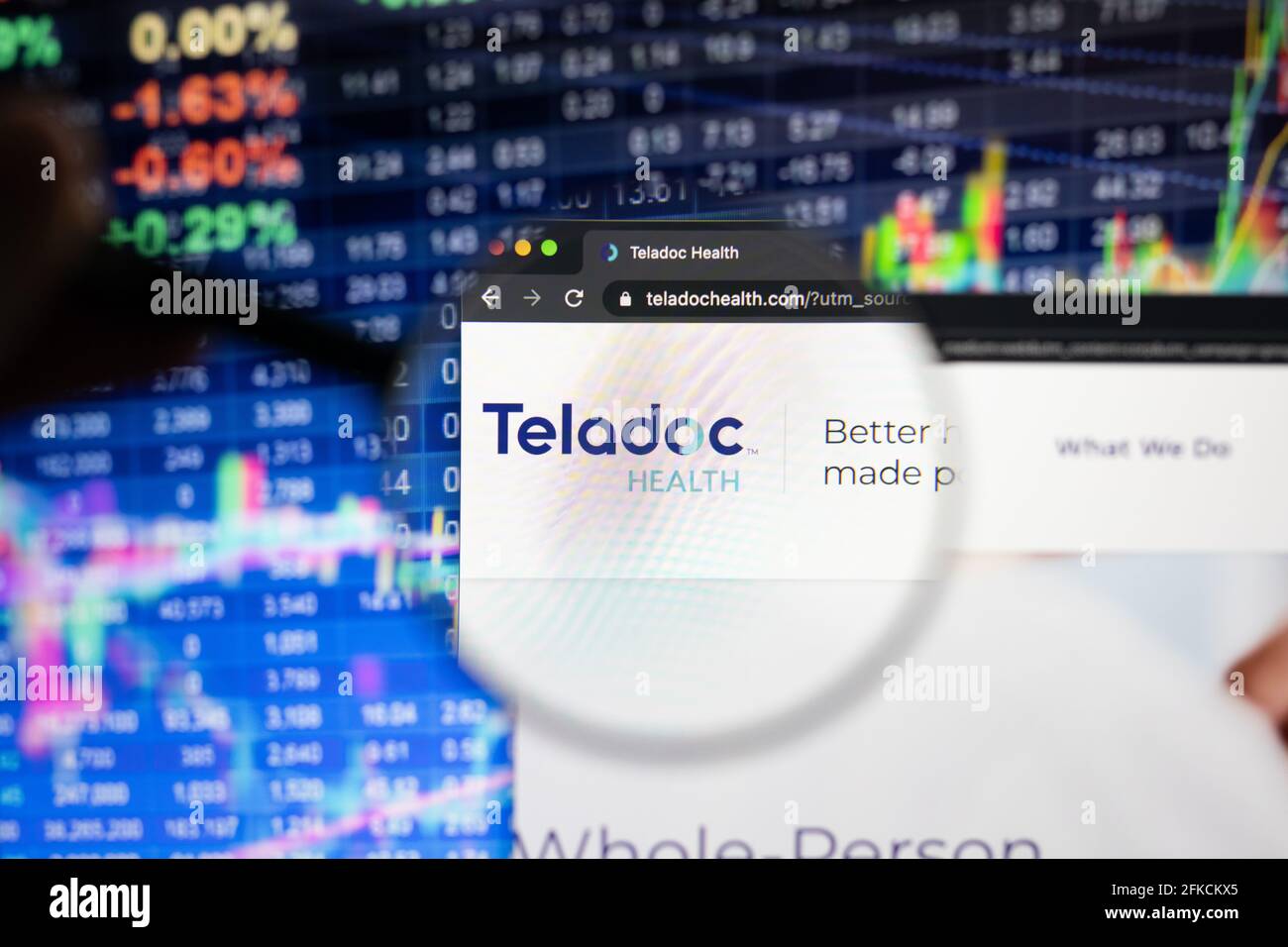 Teladoc company logo on a website with blurry stock market developments ...