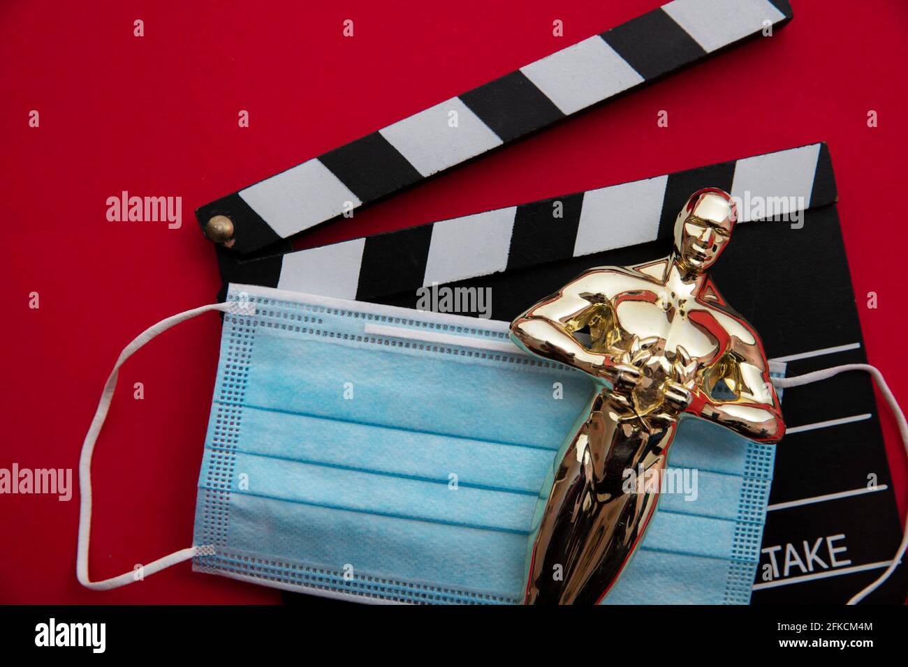 Movie and entertainment award with a coronavirus covid protective face ...