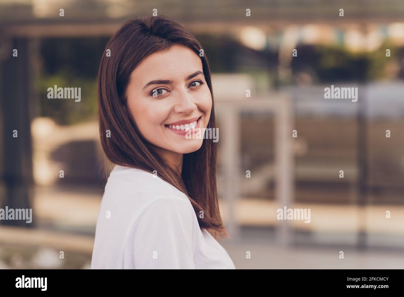 Photo of optimistic brunette lady wear white cloth walking in park ...