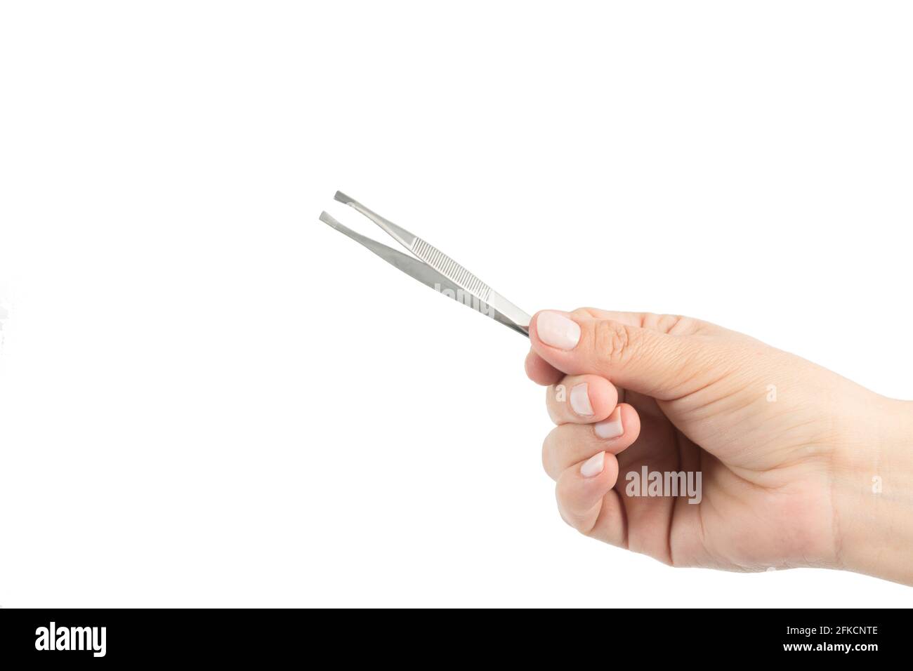 female hand holding tweezers for plucking, on white background space ...