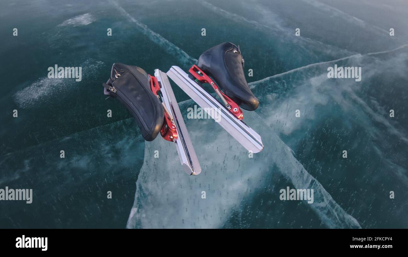 The skates are on the ice. The child train on ice speed skating. The ...