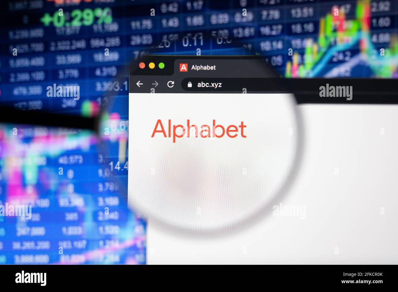 Alphabet Inc. company logo on a website with blurry stock market ...