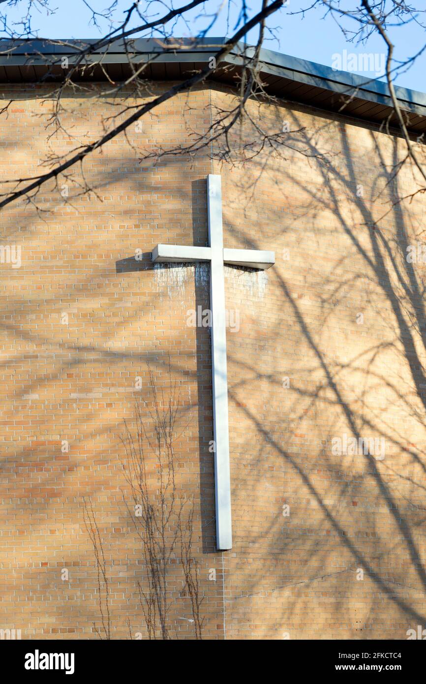 Catholic cross on the exterior brick wall of a church Stock Photo - Alamy