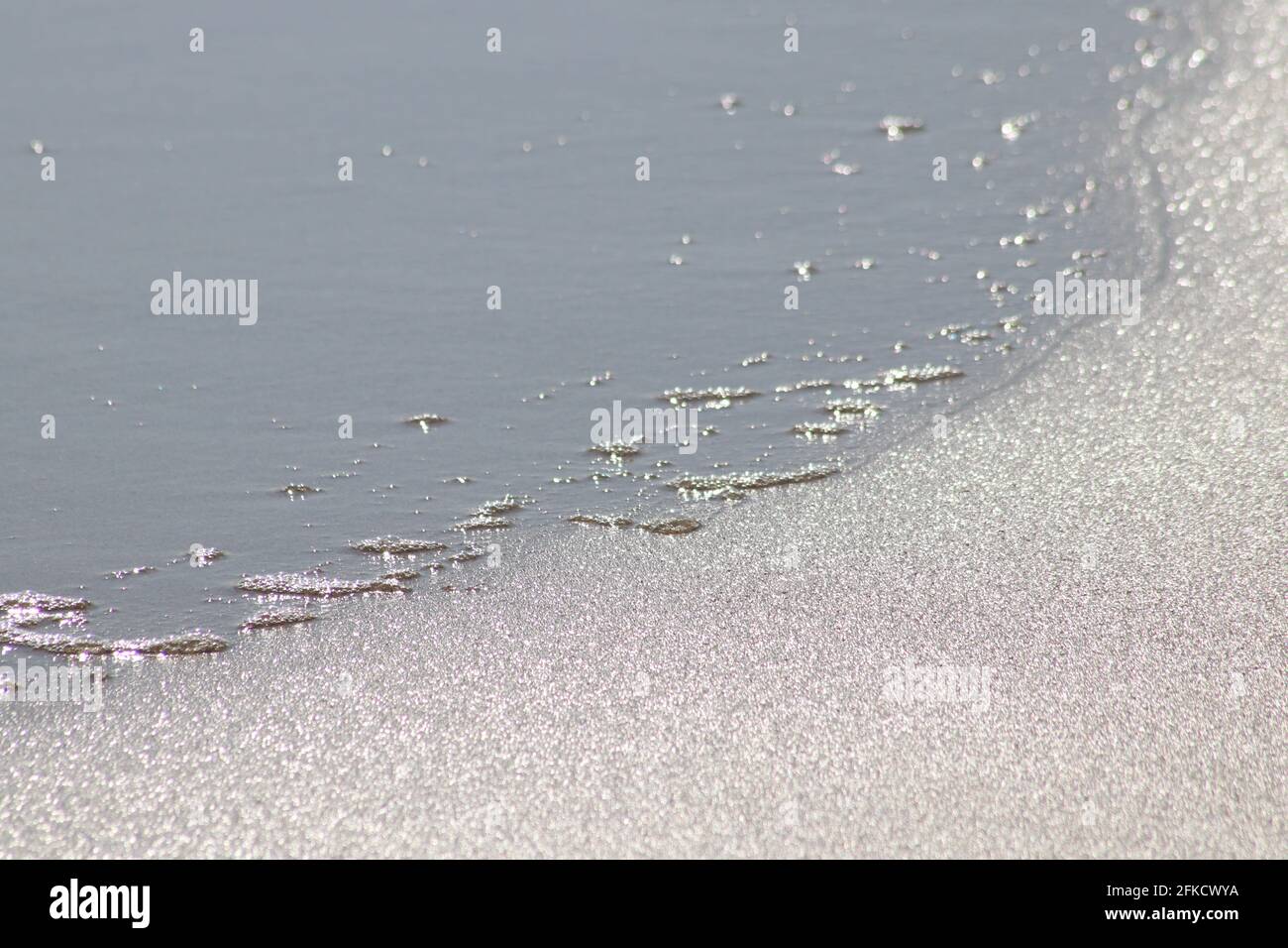 Blue bubbles on beach Stock Photo - Alamy