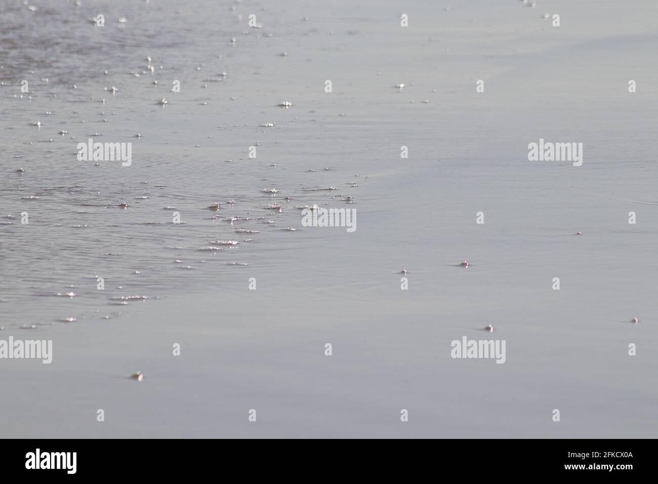 Blue bubbles on beach Stock Photo - Alamy
