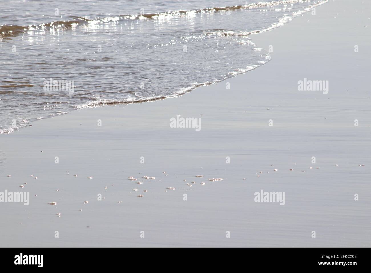 Blue bubbles on beach Stock Photo - Alamy