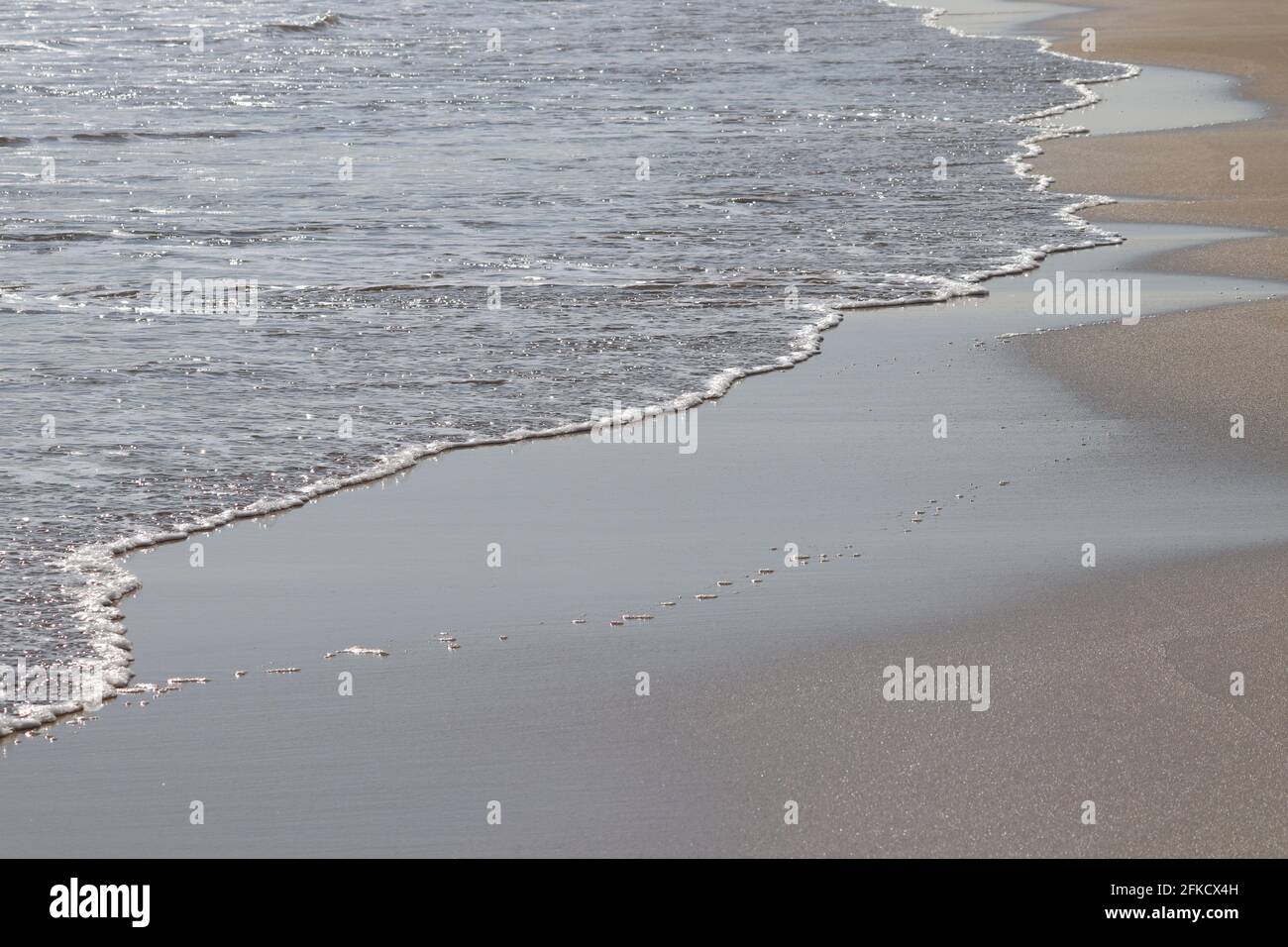 Sparkling sea and sand Stock Photo - Alamy