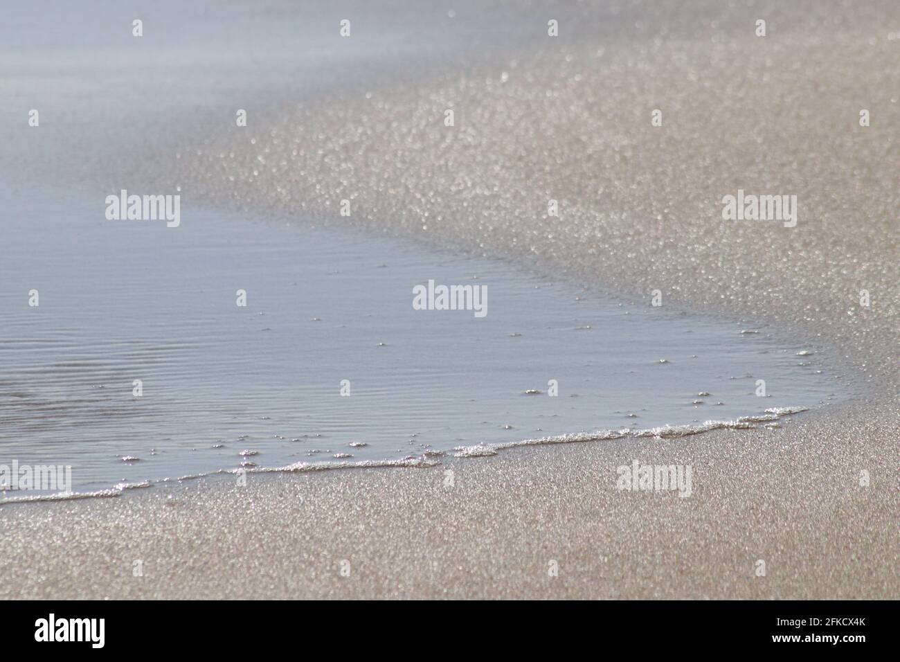 Sparkling sea and sand Stock Photo - Alamy