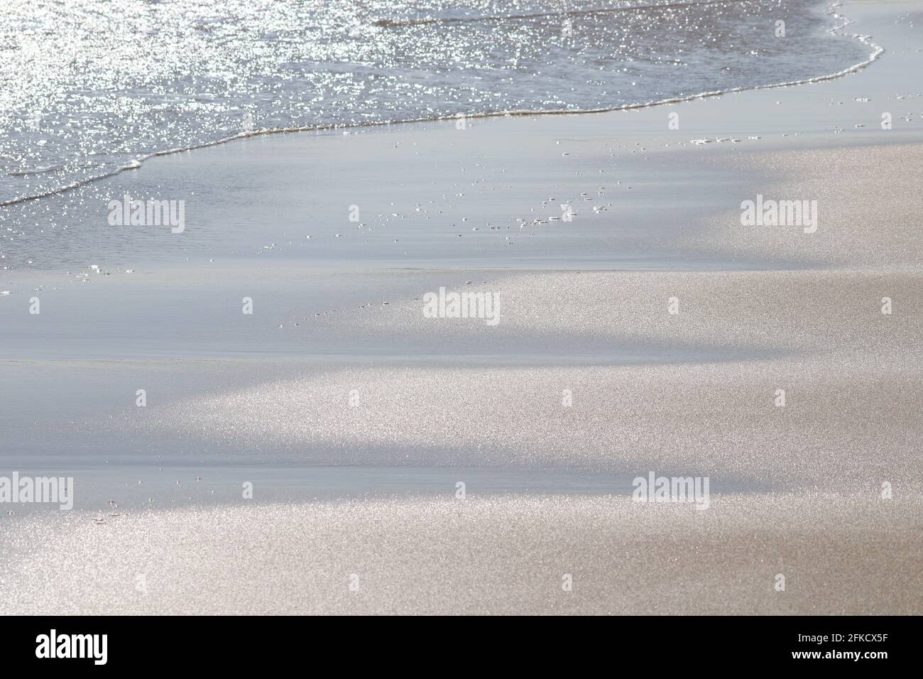 Sparkling sea and sand Stock Photo - Alamy