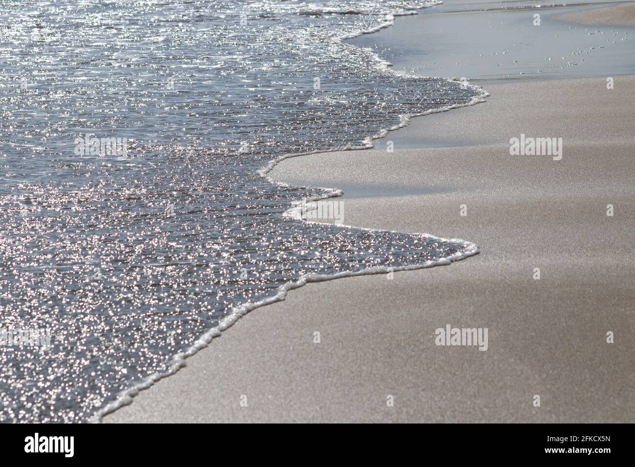 Sparkling sea and sand Stock Photo - Alamy