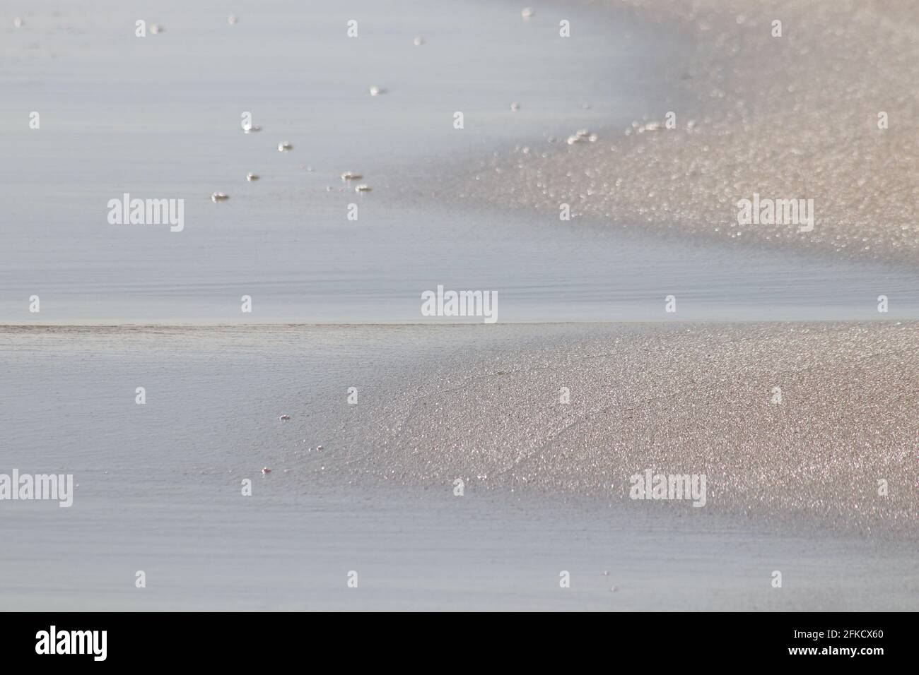 Sparkling sea and sand Stock Photo - Alamy