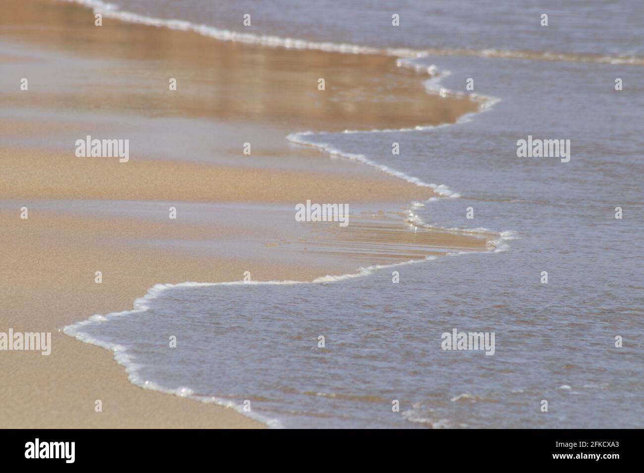 Sparkling sea and sand Stock Photo - Alamy