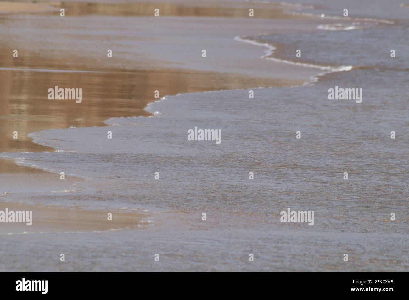 Sparkling sea and sand Stock Photo - Alamy