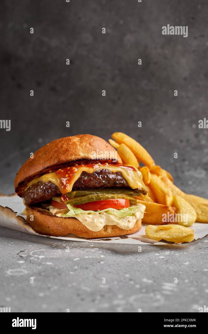 American cuisine. Royal Cheese Burger of Marble Beef with cucumbers ...