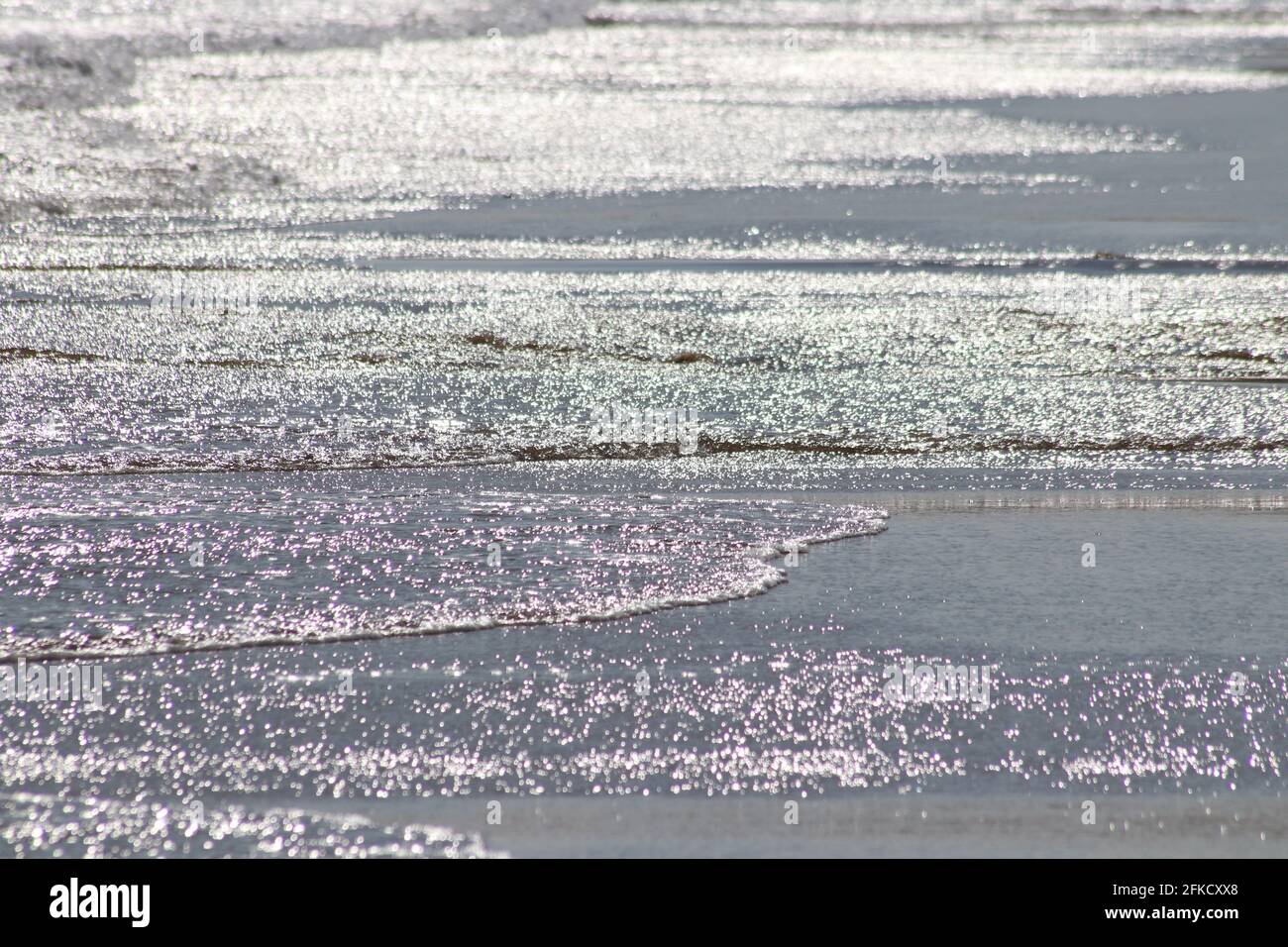 Sparkling sea and sand Stock Photo - Alamy