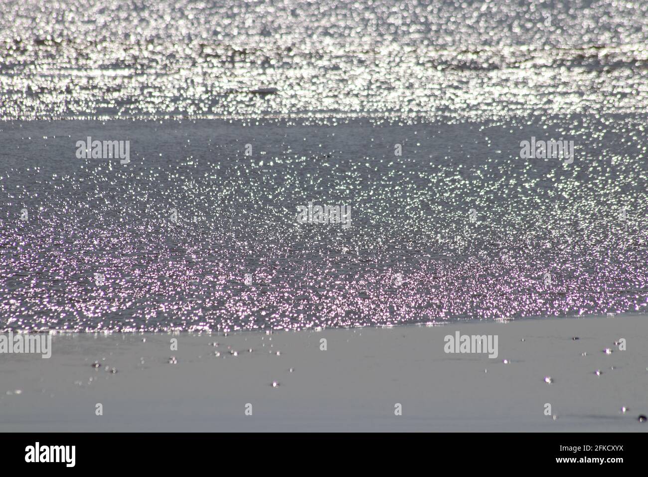 Sparkling sea and sand Stock Photo - Alamy