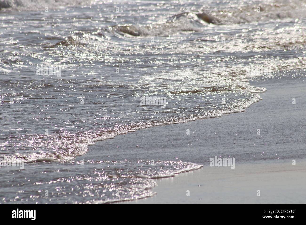 Sparkling sea and sand Stock Photo - Alamy