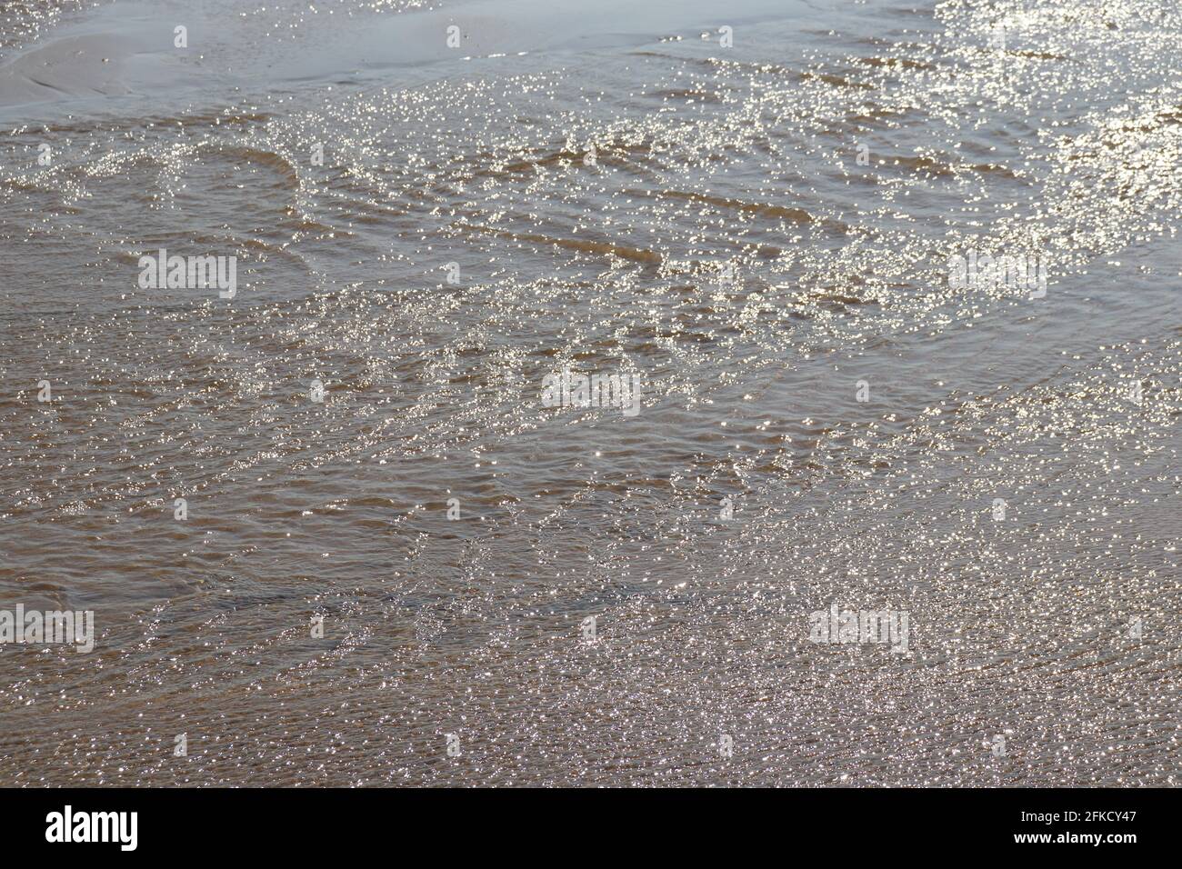 Sparkling sea and sand Stock Photo - Alamy