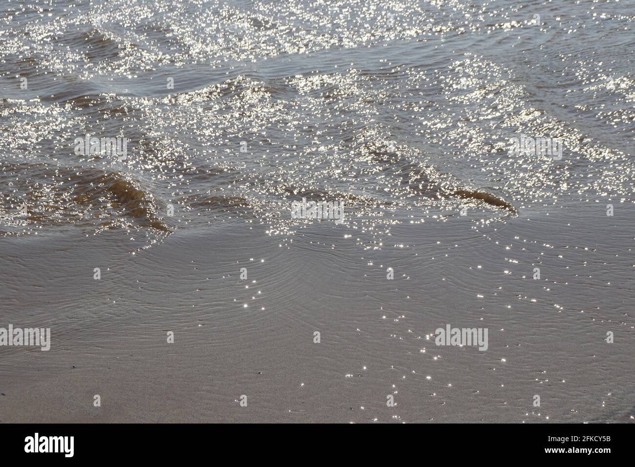 Sparkling sea and sand Stock Photo - Alamy