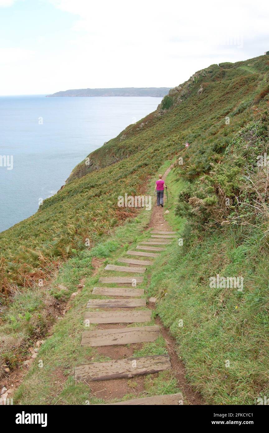 Steps by the sea Jersey path on cliff walking up the side of a hill eep ...