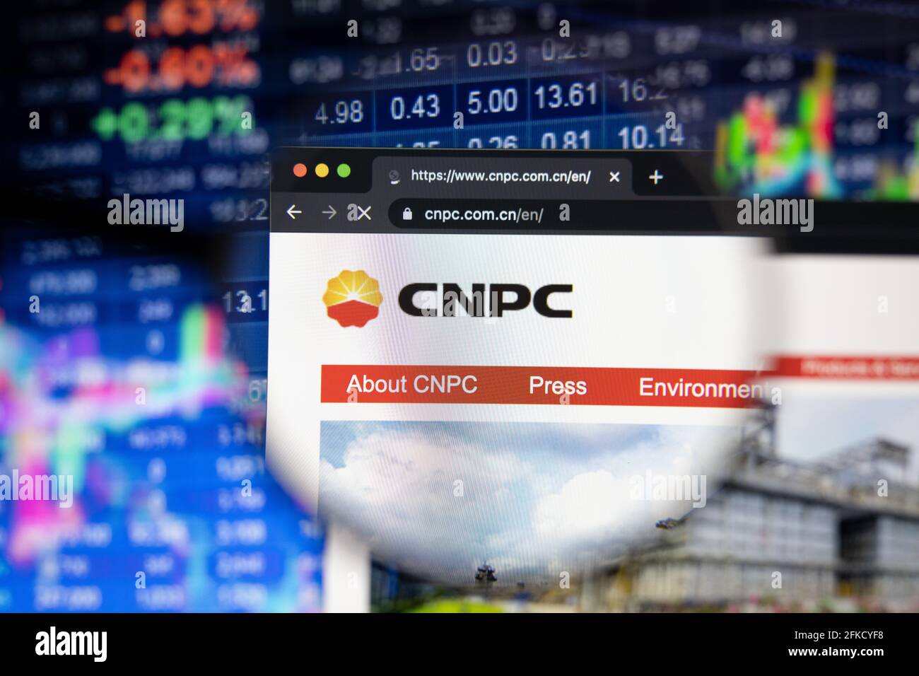CNPC company logo on a website with blurry stock market developments in ...