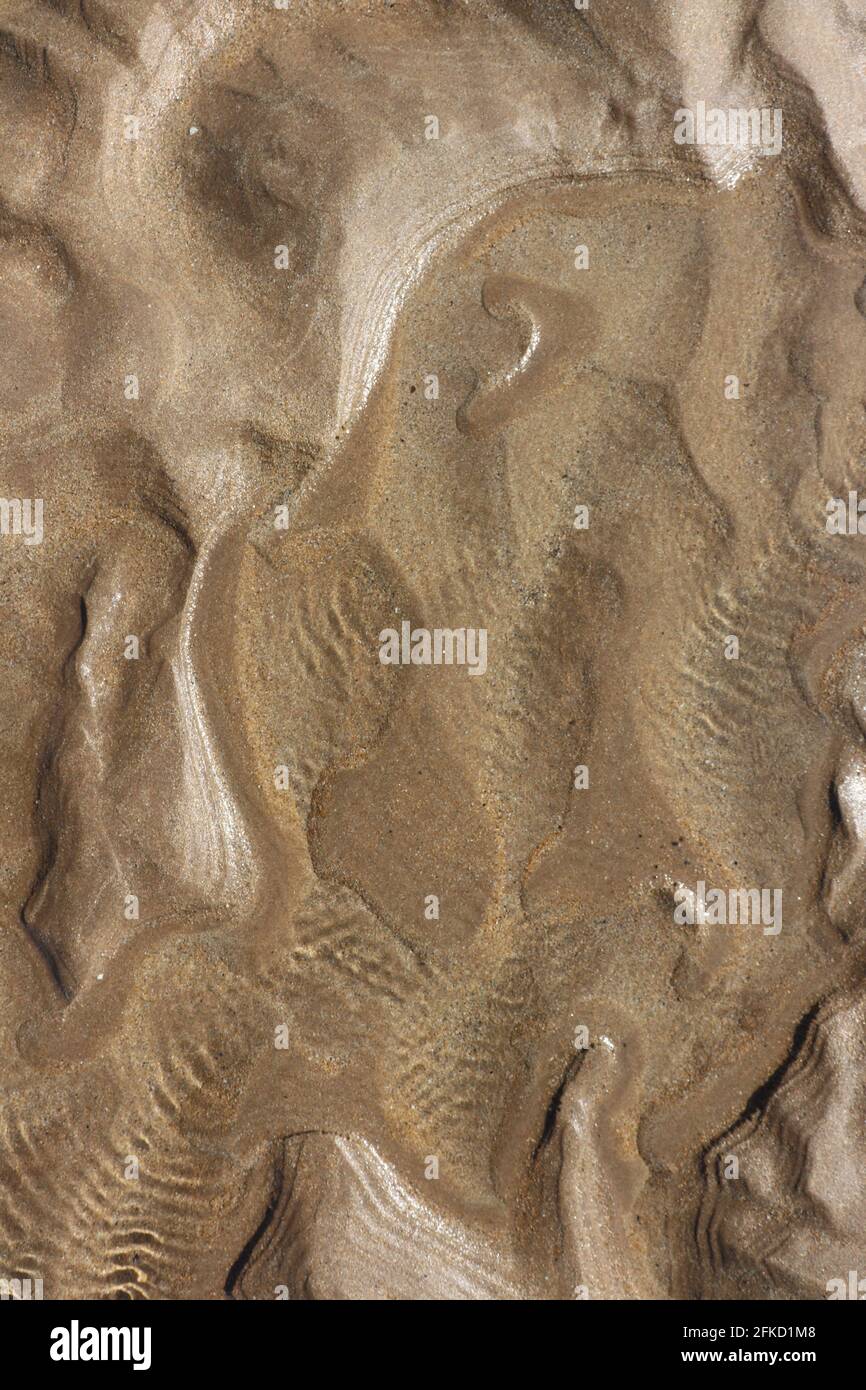 Patterns and textures in sand and seawater Stock Photo - Alamy