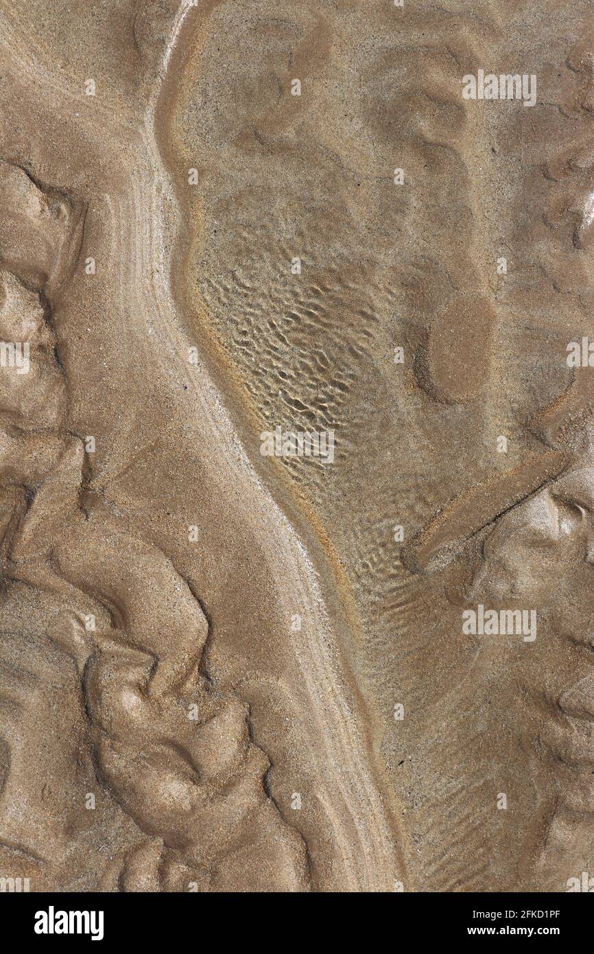 Patterns and textures in sand and seawater Stock Photo - Alamy