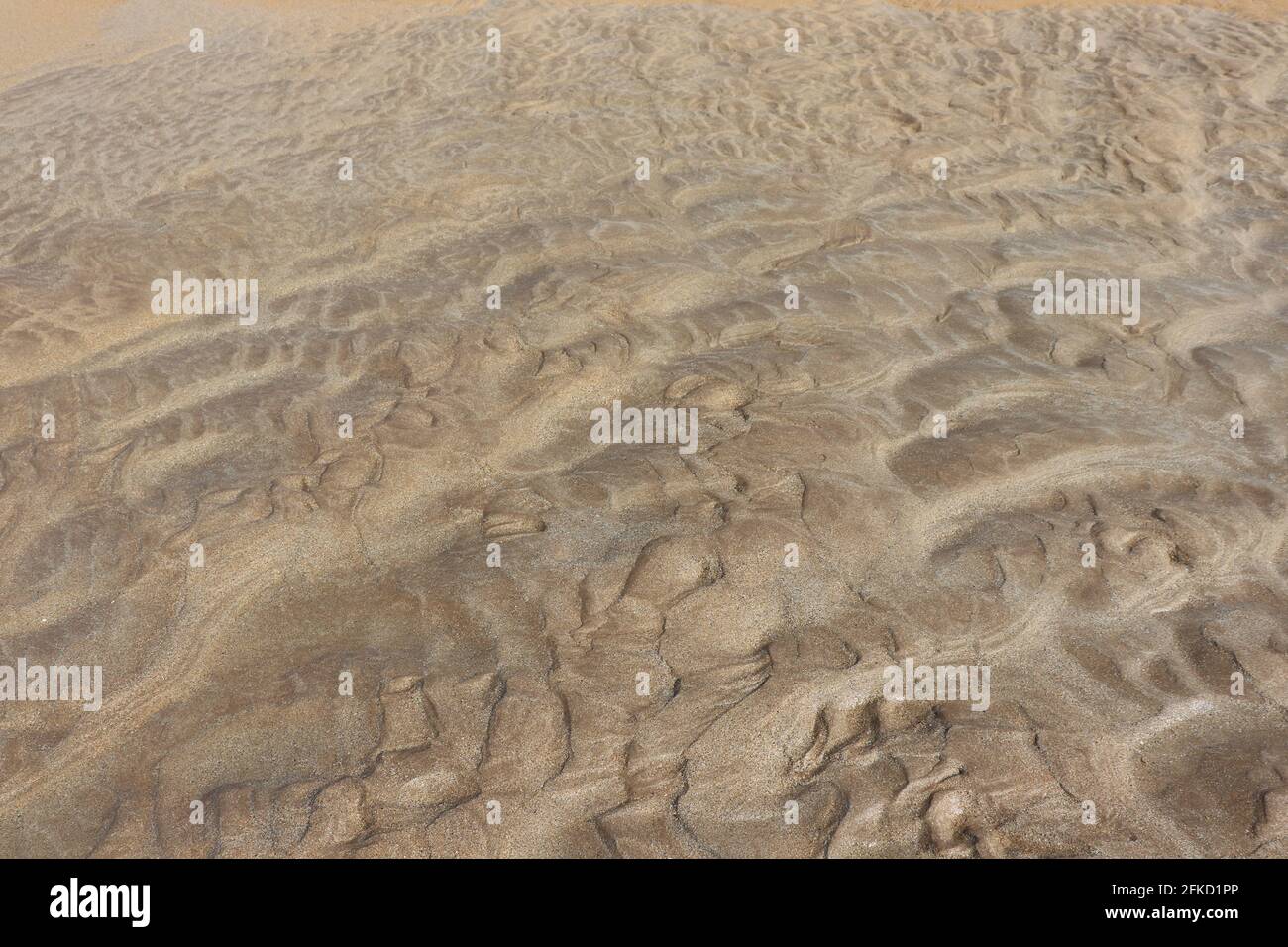 Patterns and textures in sand and seawater Stock Photo - Alamy