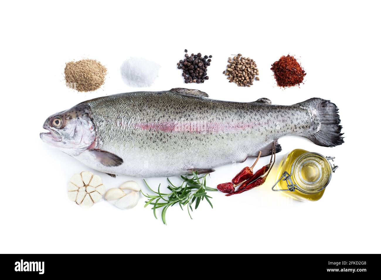Whole raw rainbow trout fish with different spices isolated on white ...