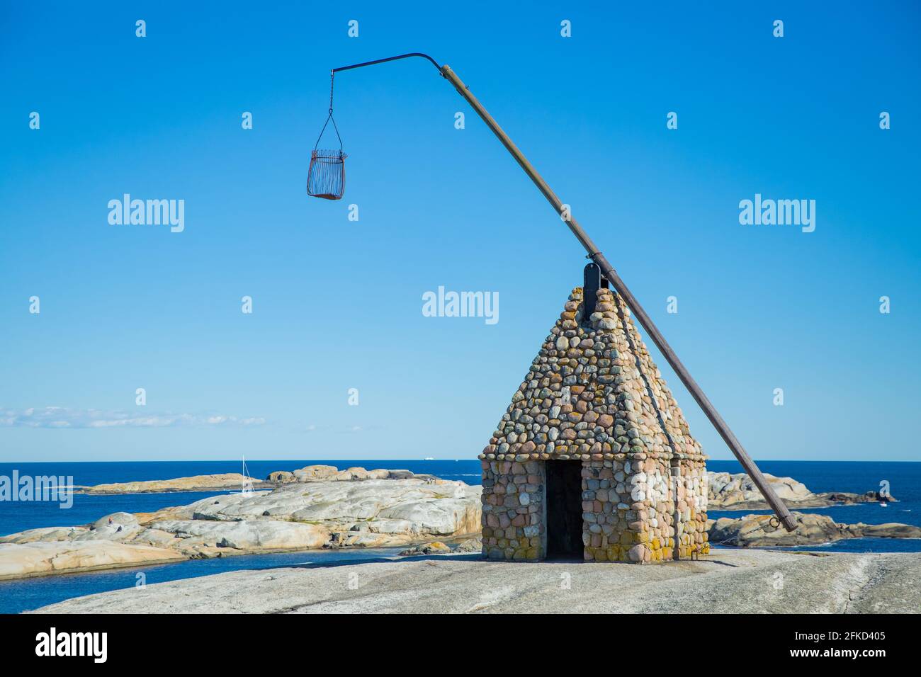 Replica of an old lighthouse. Serene Scandinavian summer landscape on ...