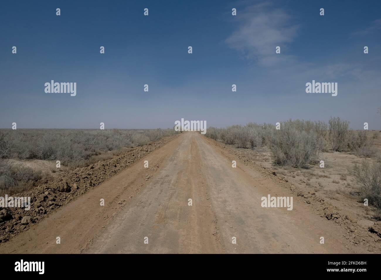 A dirt road which runs through the Aralkum Desert, the youngest desert ...
