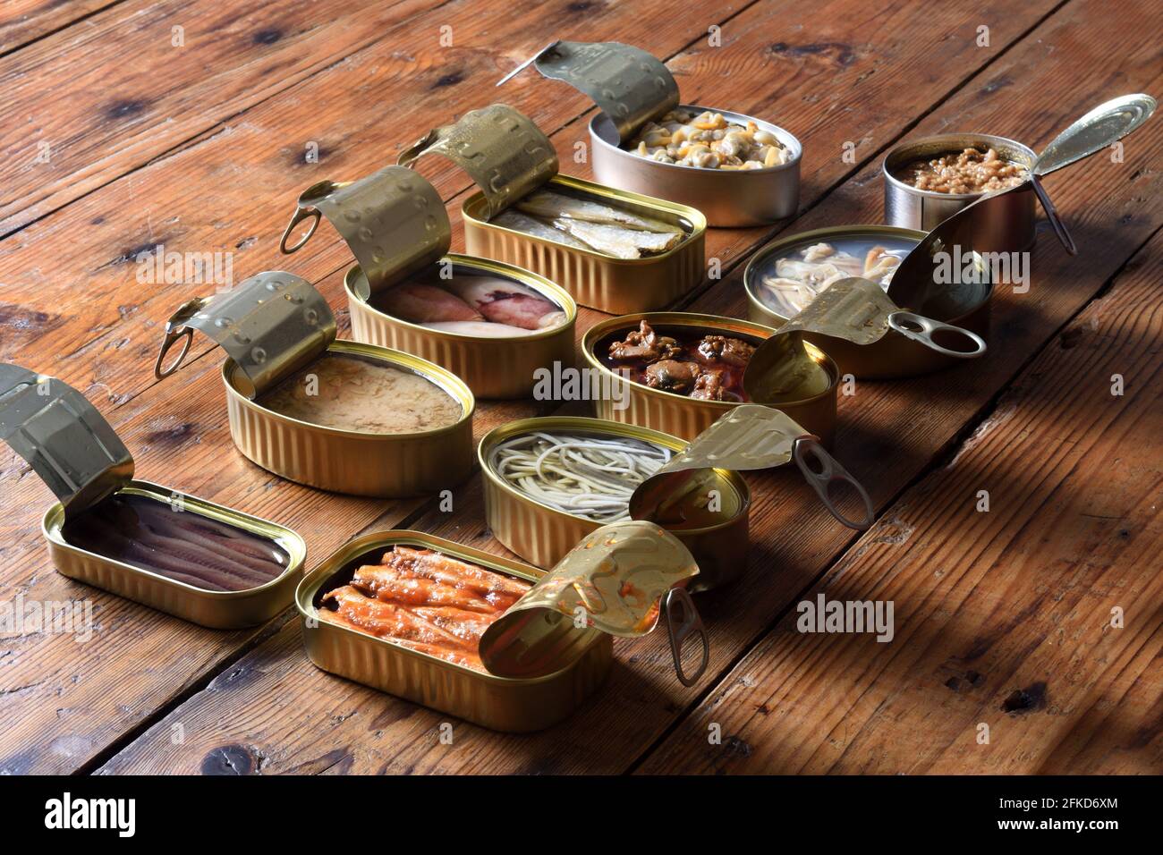 set of cans with fish and seafood on wooden background, face to face ...