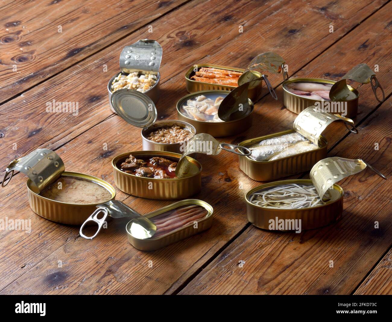 set of cans with fish and seafood on wooden background Stock Photo - Alamy
