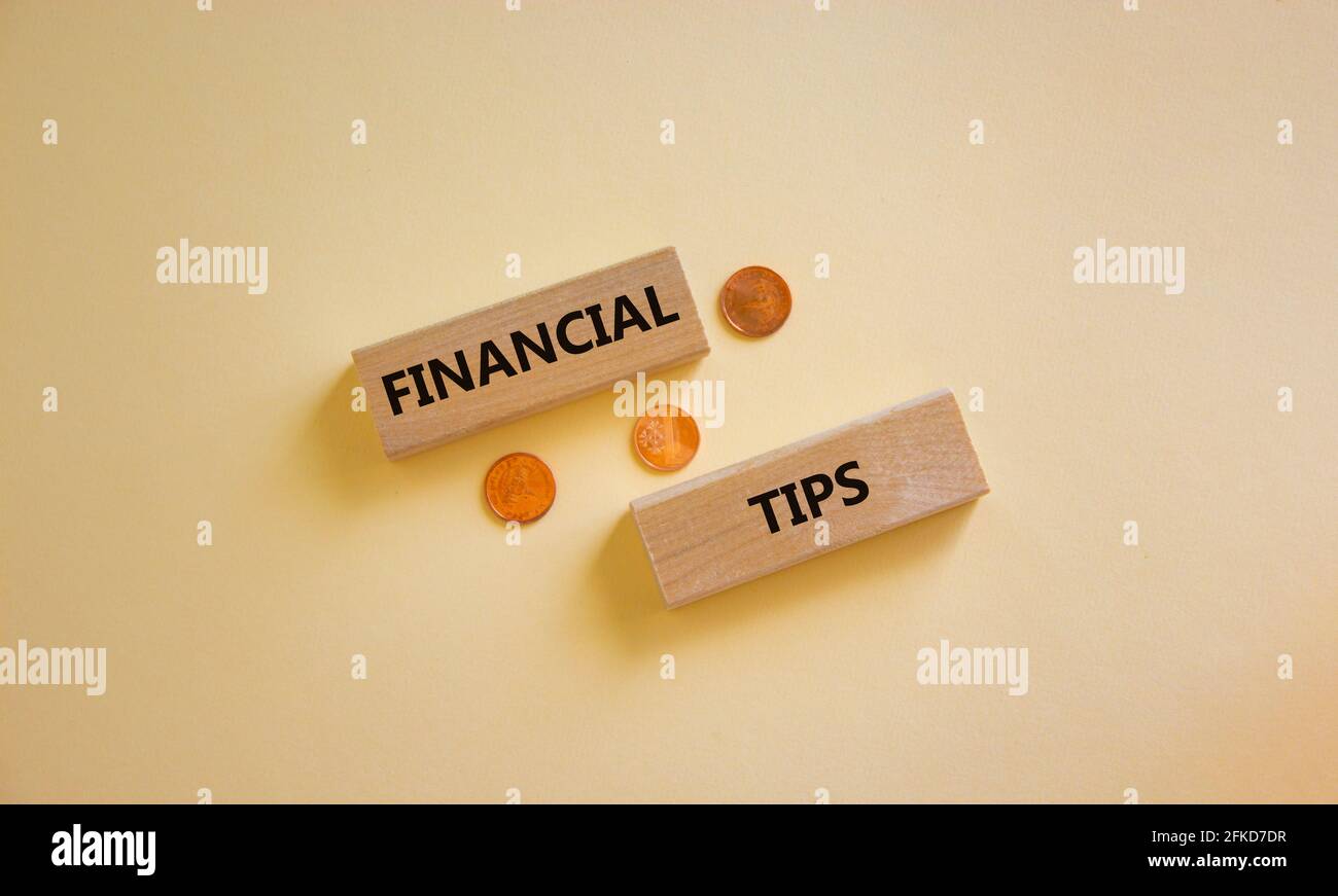Financial tips symbol. Wooden blocks with words 'Financial tips' on ...