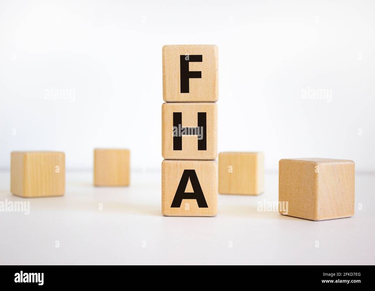 FHA, federal housing administration symbol. Wooden cubes with words FHA ...