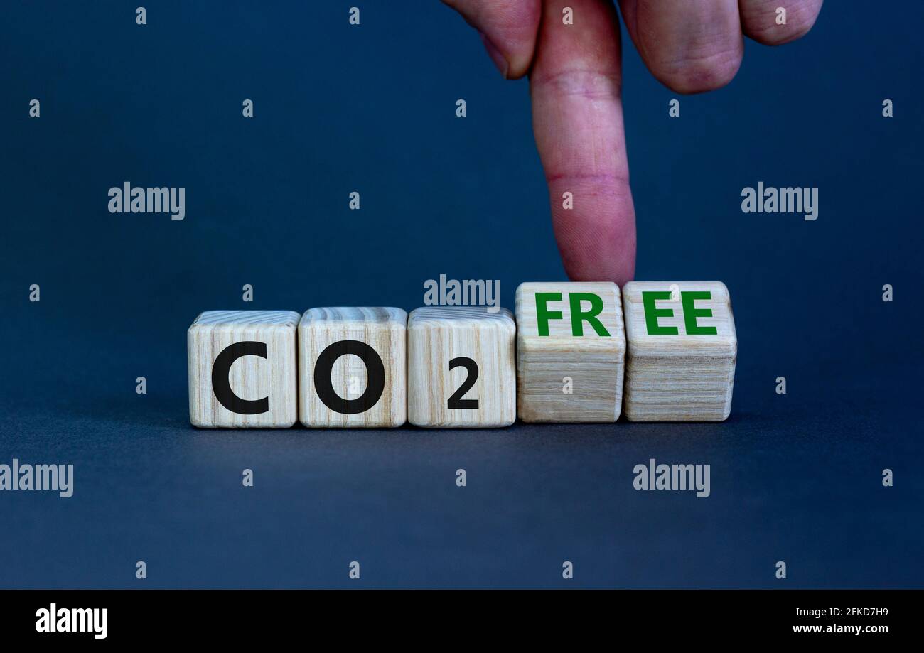 CO2 free symbol. Businessman turns cubes, changes concept words 'CO2 ...