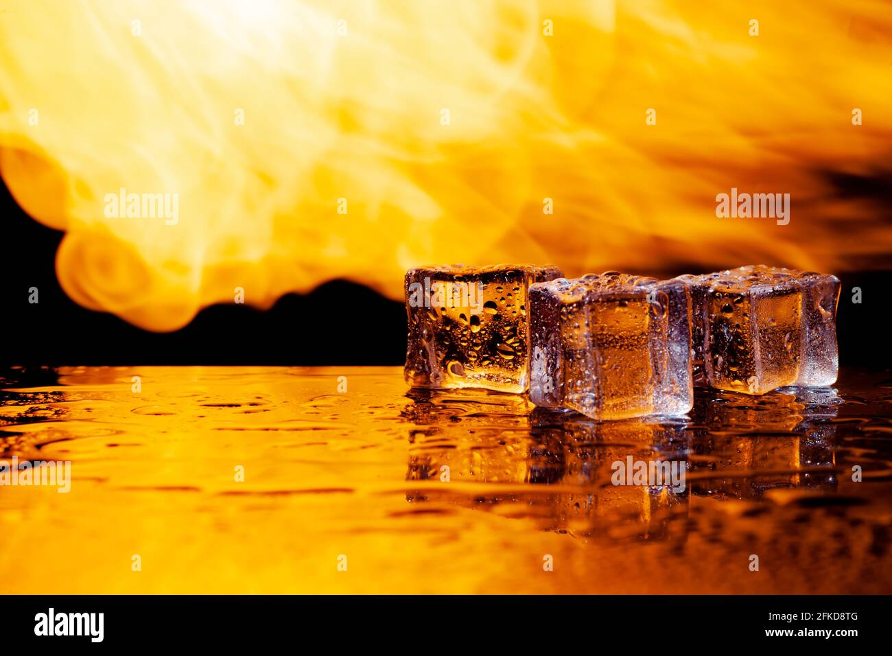 fire and ice, ice cubes and flames, black background Stock Photo - Alamy