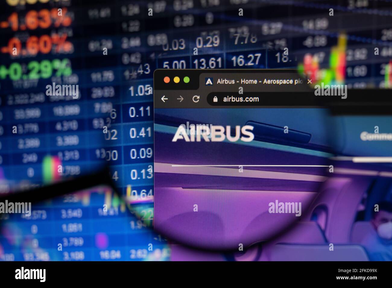 Airbus company logo on a website with blurry stock market developments in the background, seen ...