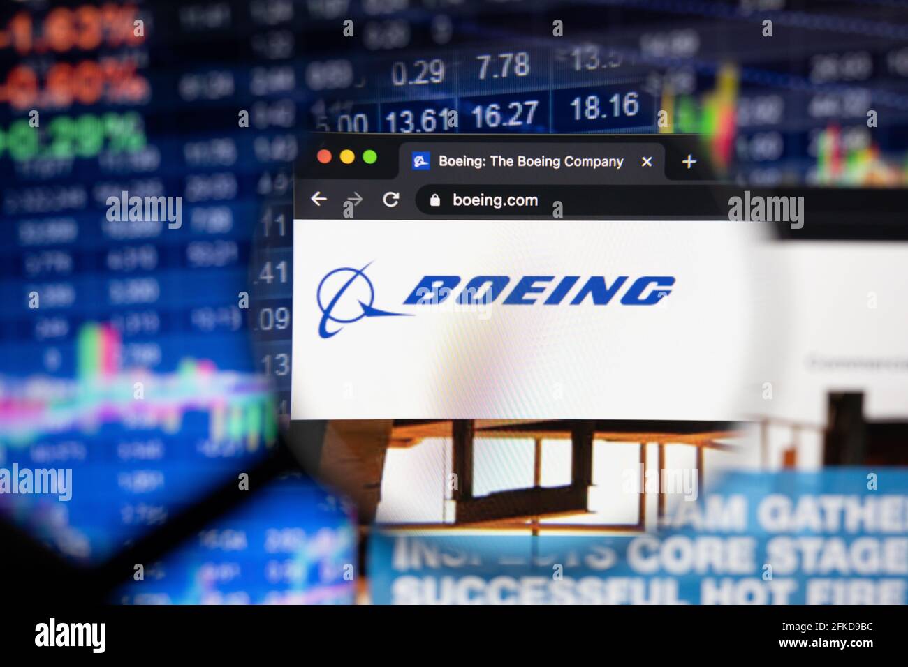 Boeing company logo on a website with blurry stock market developments ...