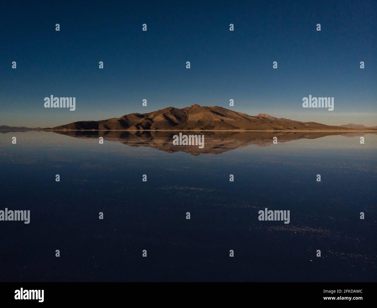 Andes mountains sunrise panorama mirror reflection on Salar de Uyuni ...